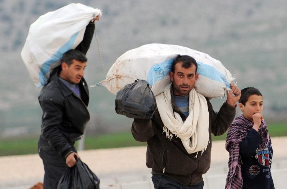 Fotos aus Syrien: Auf der Flucht vor Assads Getreuen | DIE ZEIT